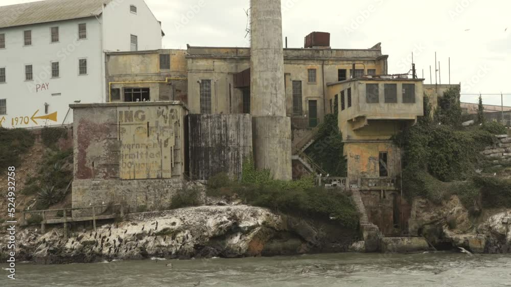 This video shows an old and abandoned factory on the edge of a sea ...