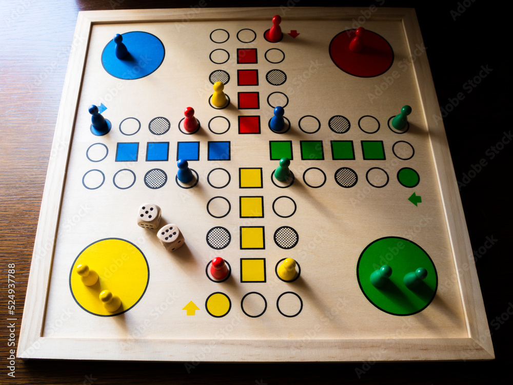 Ludo board game playing on a table Stock Photo | Adobe Stock