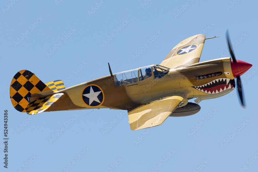 Extremely close view of a WWII fighter plane (P-40 Warhawk) against the ...