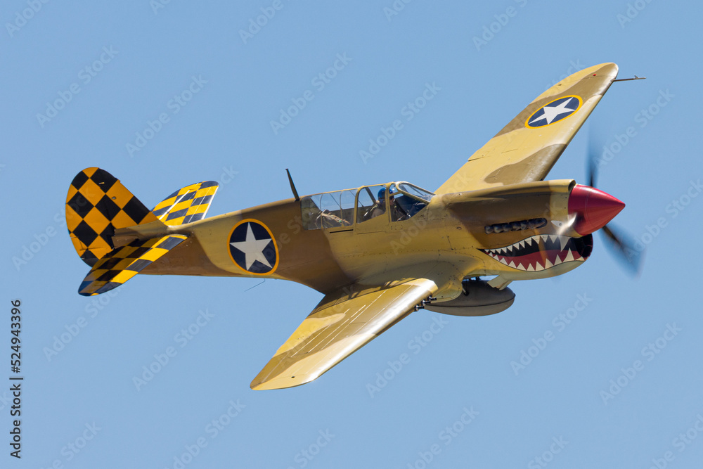 Extremely close view of a WWII fighter plane (P-40 Warhawk) against the sky, in epic light Stock ...