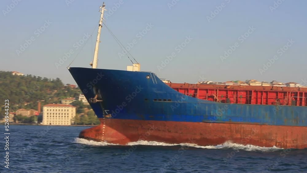 Genaral Cargo Ship. Tracking Shot. A cargo ship or a freighter ship is ...