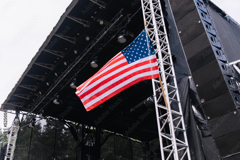 Close-up of USA Flag flying on the stage construction. American flag ...
