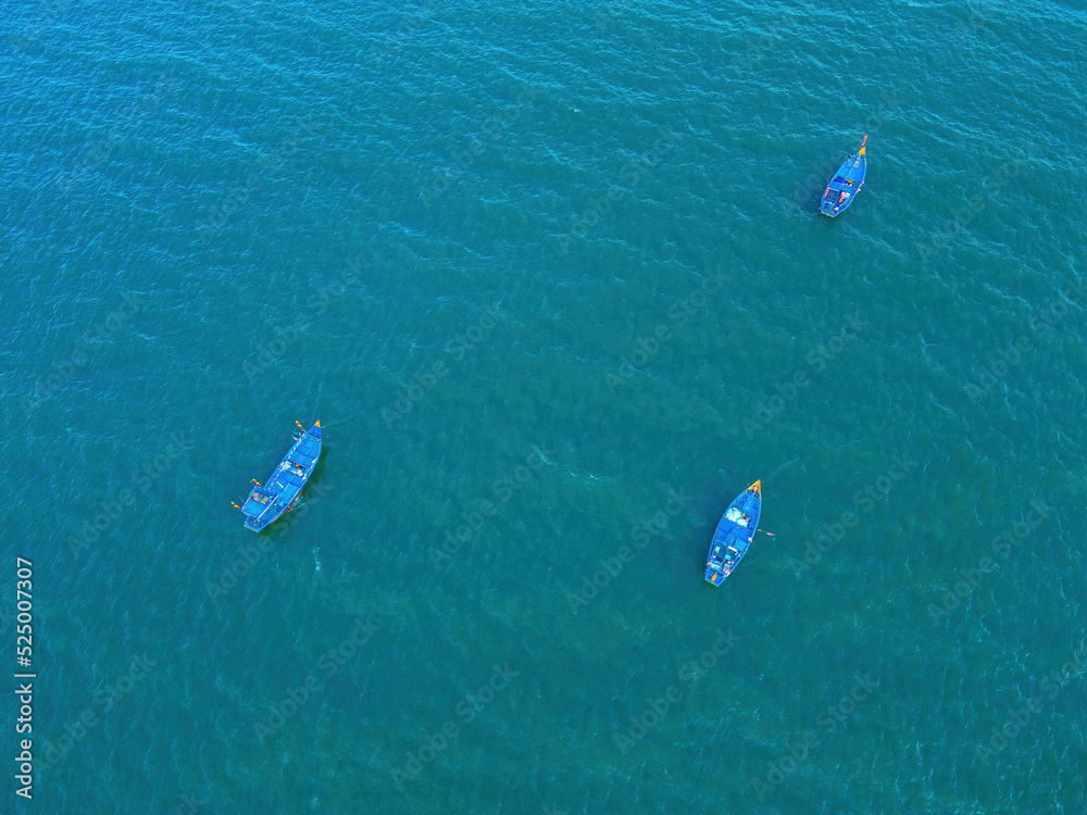 Top view, aerial view wooden fishing boat on the beach from a drone ...