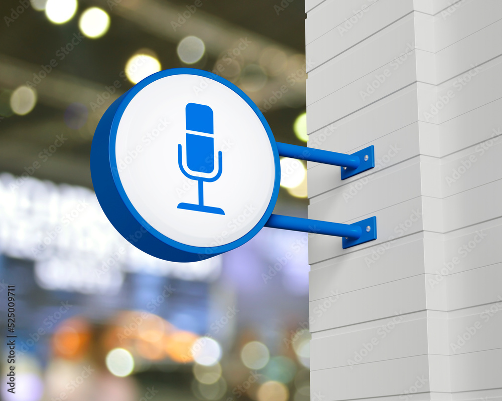 Microphone icon on hanging blue rounded signboard over blur light and ...
