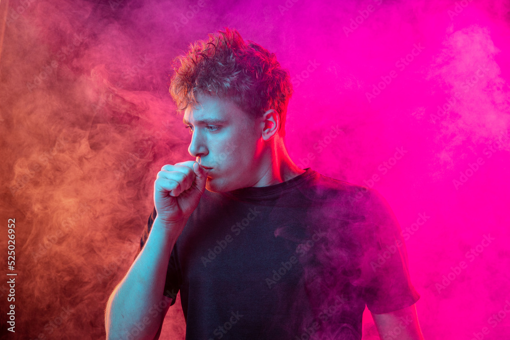 Suffocate in the smoke. Scared young man with stressed emotions ...