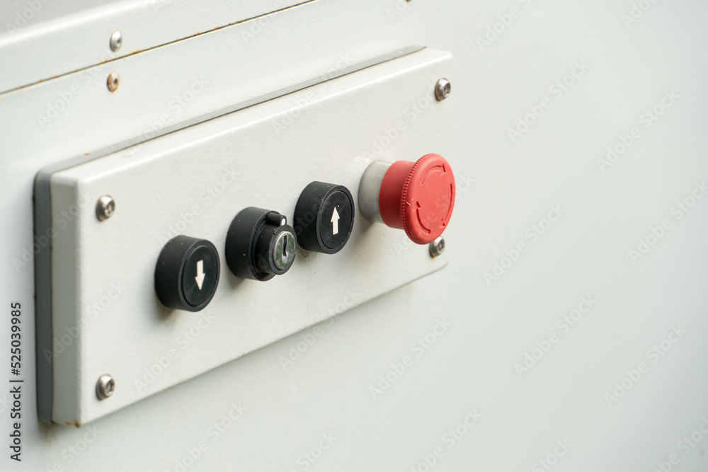 A mechanical device with a remote control and large buttons. Electrical ...