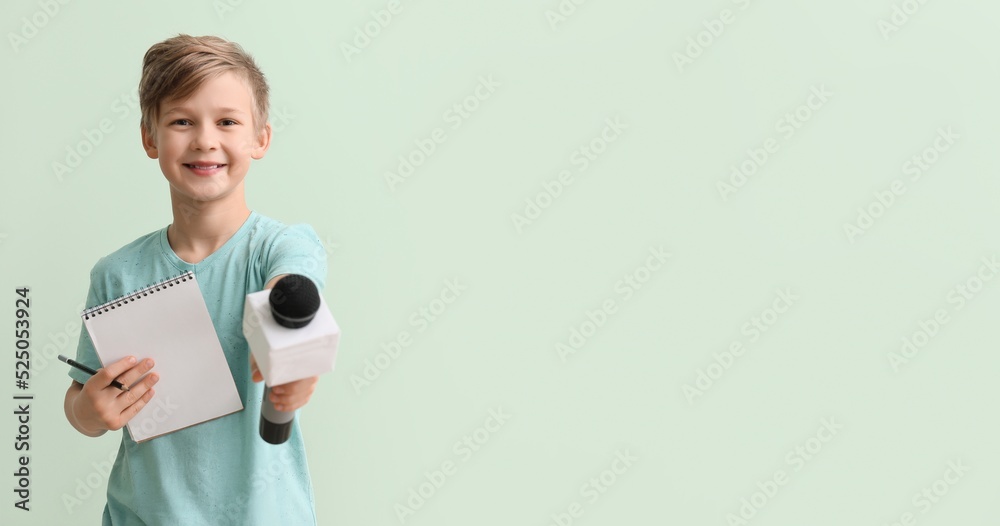 Little journalist with microphone and notebook on color background with ...