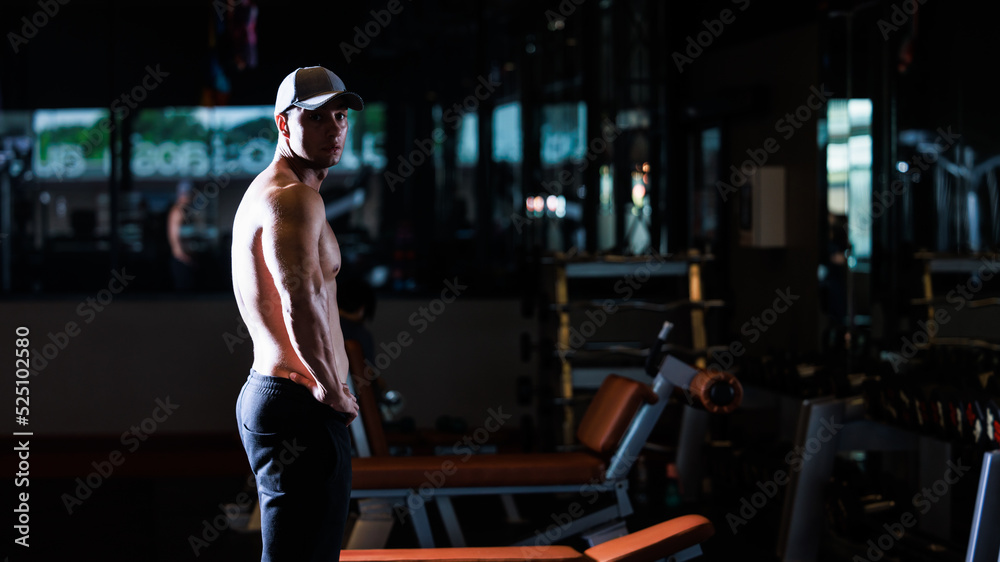 portrait foreigner trainer poses showing his muscles in gym, Stock ...