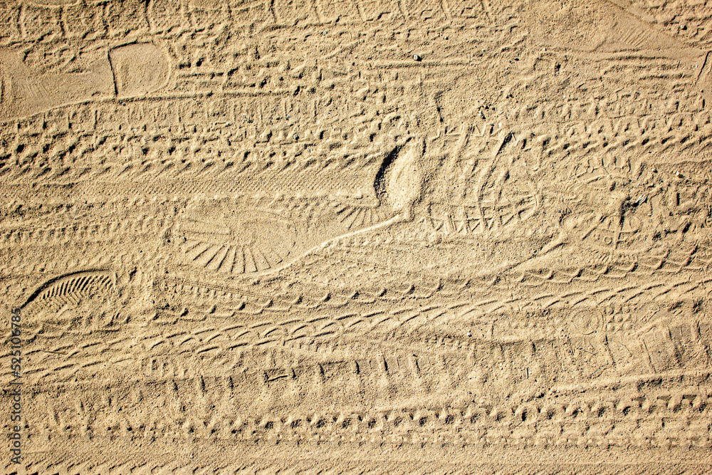 The texture of the sandy road. Road sand. Yellow sand in the sun with ...