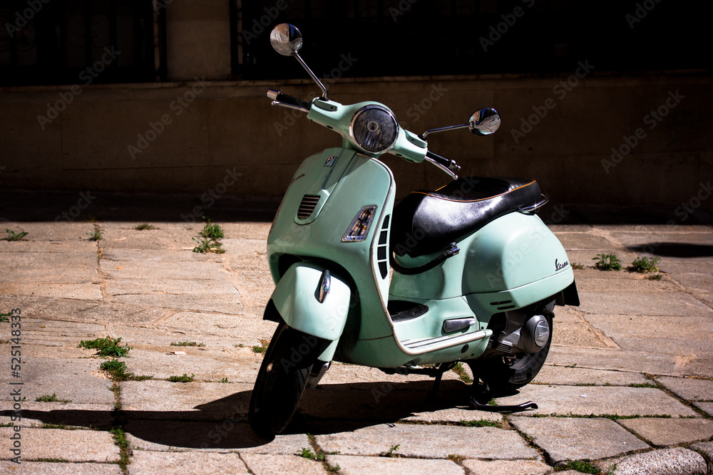Madrid, Spain. August 1, 2022. A blue turquoise vintage moped ...