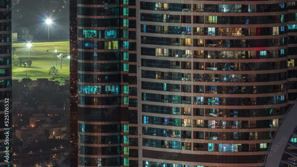 Windows in high-rise recidential building in the late evening with ...