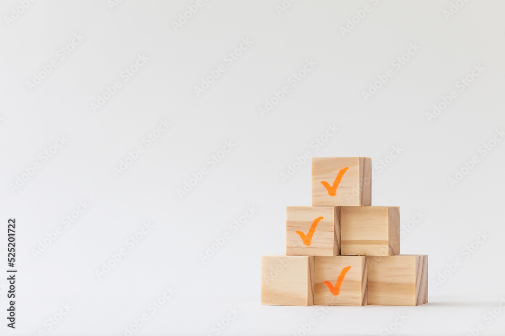 wooden block with check mark on white background Stock Photo | Adobe Stock