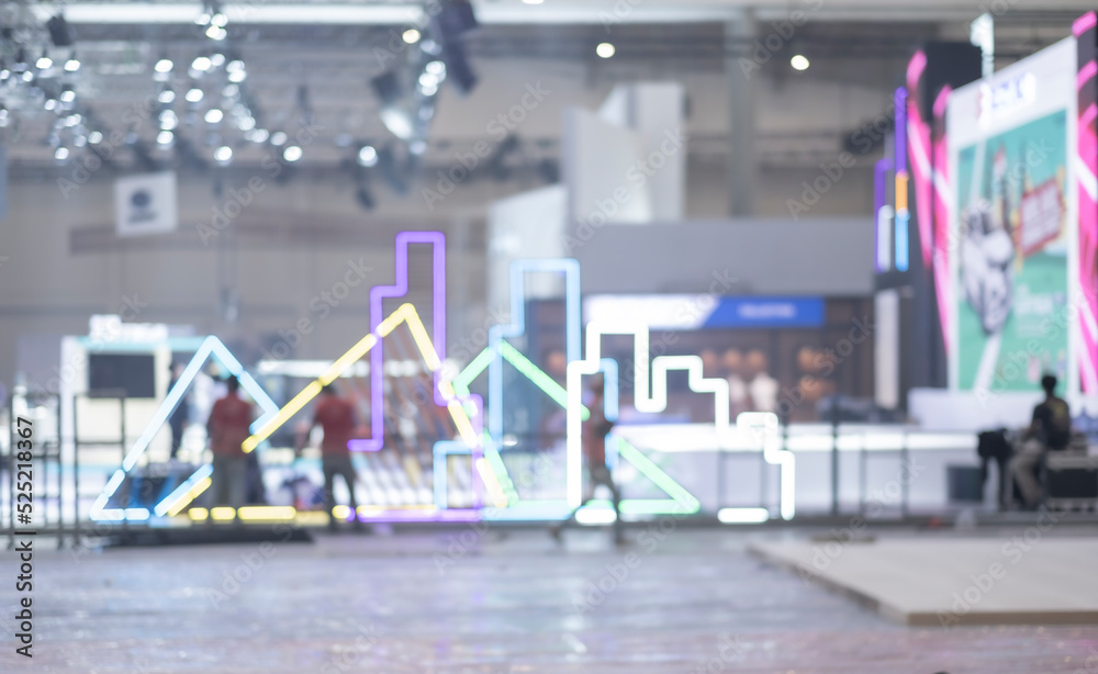 Blurry workers preparing exhibition event hall. Bokeh background of ...