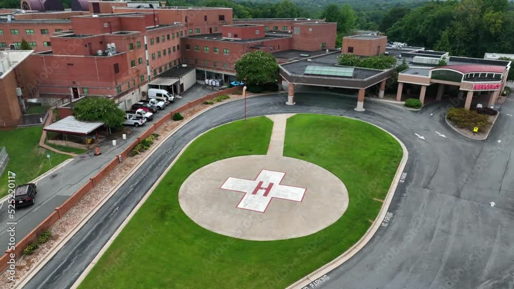 Helipad heliport at medical hospital. Emergency sign entrance and ...
