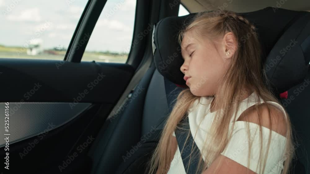 Caucasian little girl sleeping while riding in car. Shot with RED ...