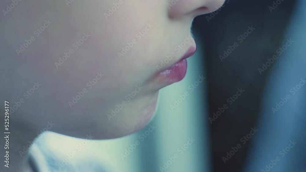 part of the face of the mouth of a close-up caucasian boy 7-8 years old ...