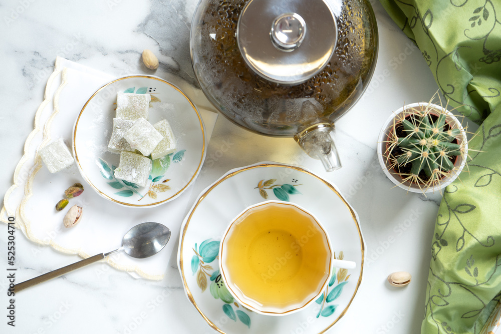 cup of fresh green tea and a cube of soft Turkish delight, Turkish tea ...