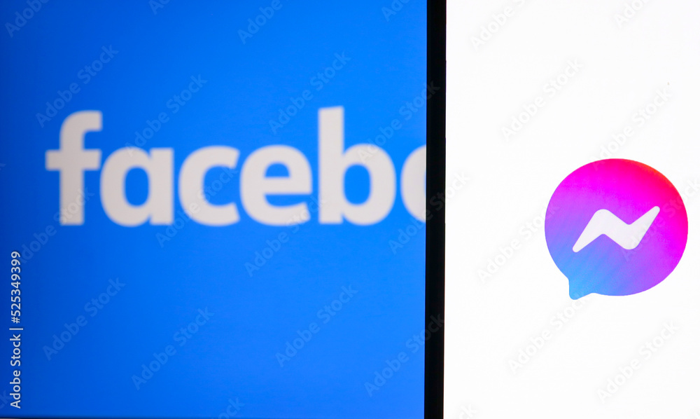 Facebook messenger logo on phone screen and Facebook logo background on ...