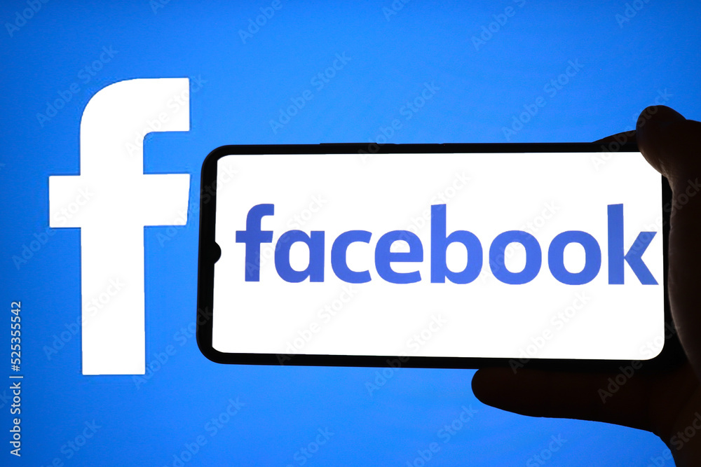 Facebook logo on the smartphone screen and Facebook logo background ...