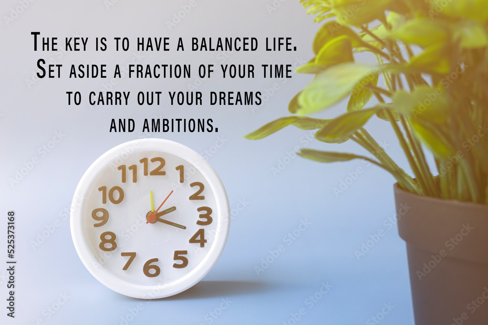 Motivational and inspirational quote with white alarm clock and potted ...