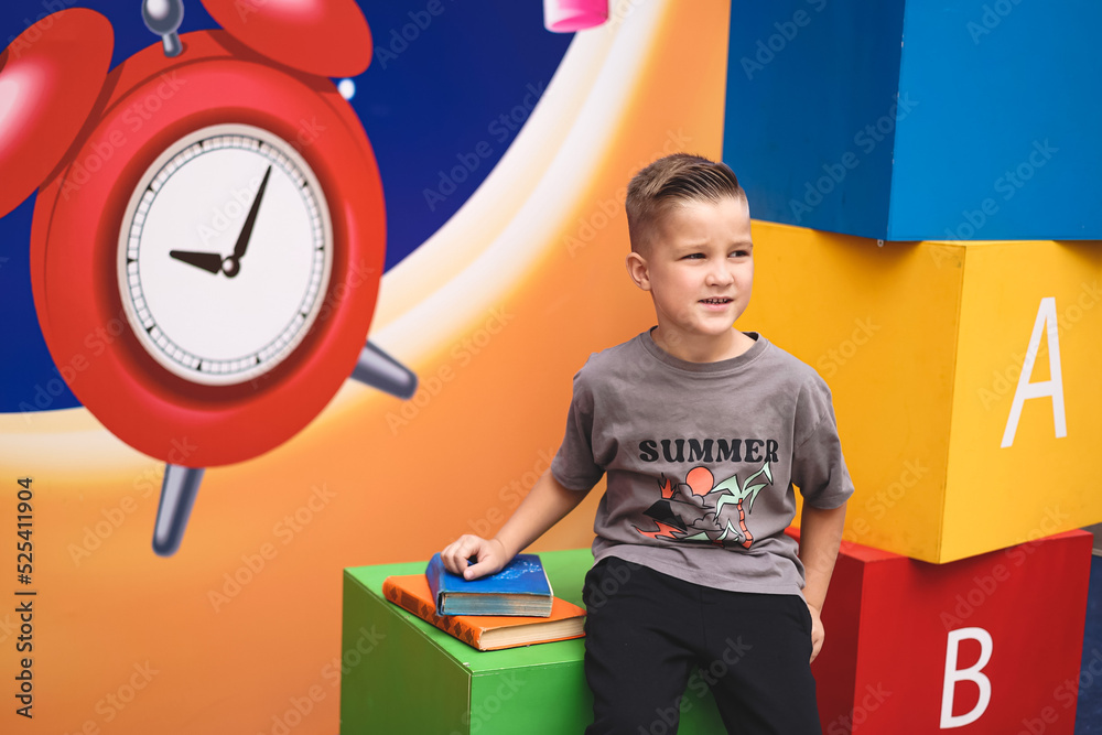 Cute boy on the colorful, bright, school background with various school ...