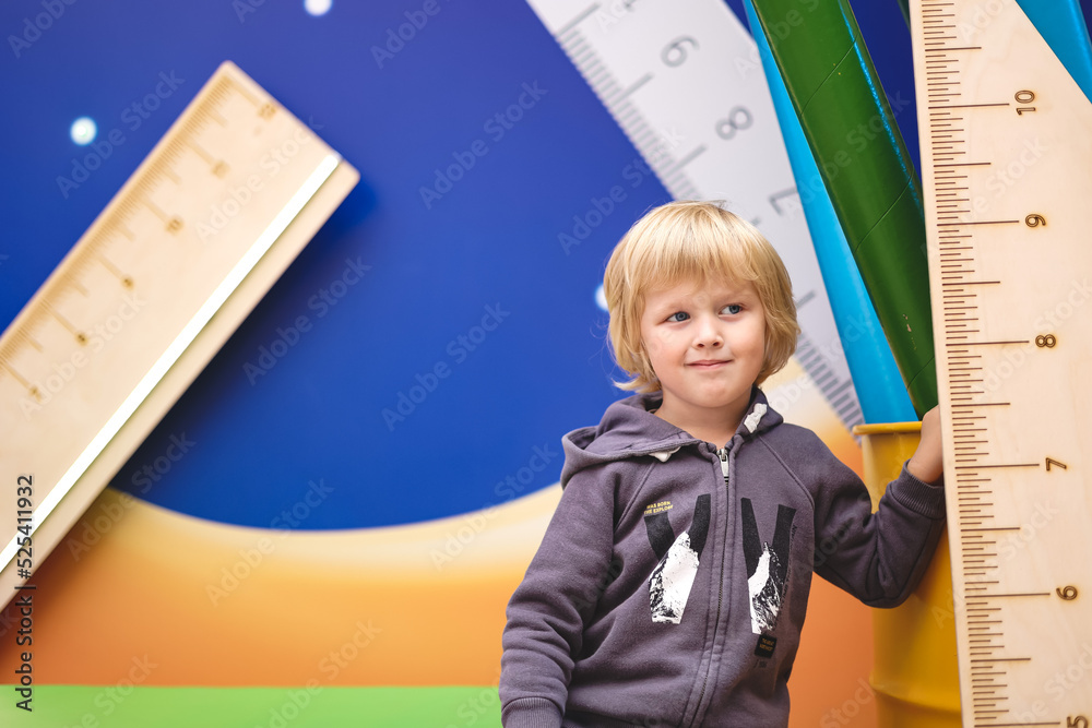 Cute boy on the colorful, bright, school background with various school ...