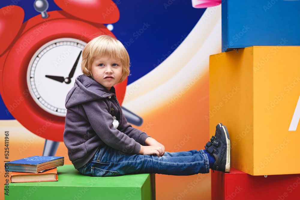 Cute boy on the colorful, bright, school background with various school ...