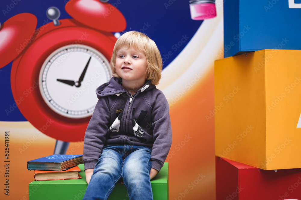 Cute boy on the colorful, bright, school background with various school ...