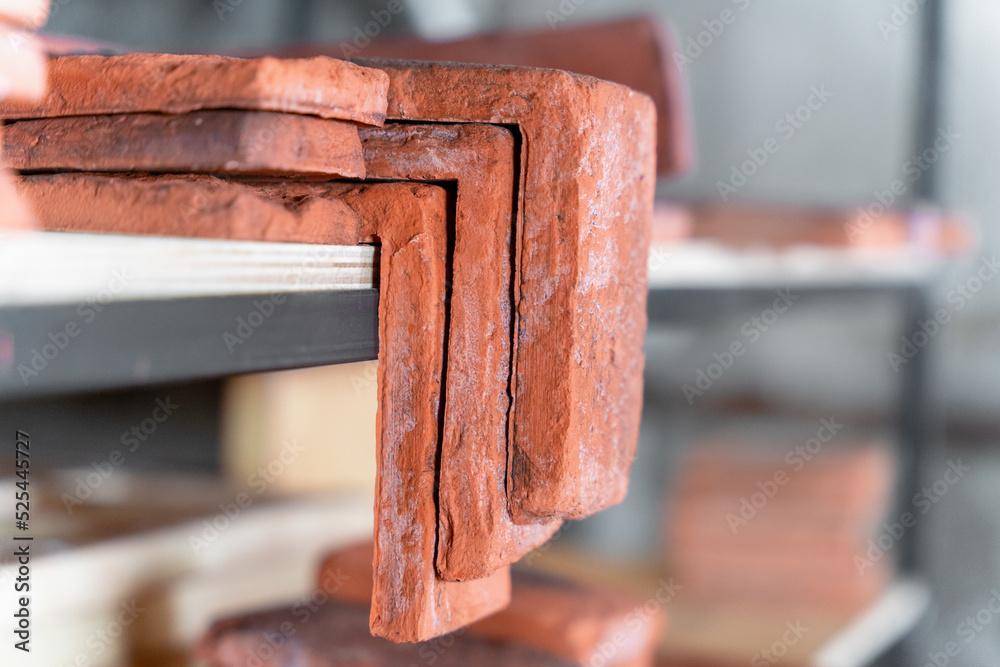 Shelves of shelves with stacks of decorative bricks in close-up. Craft ...