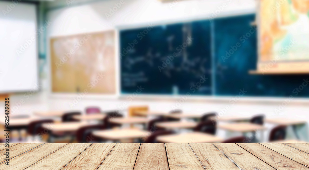 Empty wooden desk space platform with school classroom background for ...