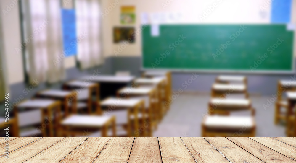Empty wooden desk space platform with school classroom background for ...