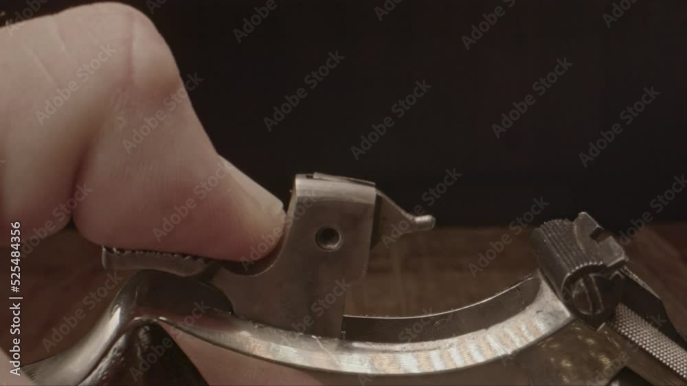 Thumb pulling back hammer on old western revolver Stock 비디오 | Adobe Stock