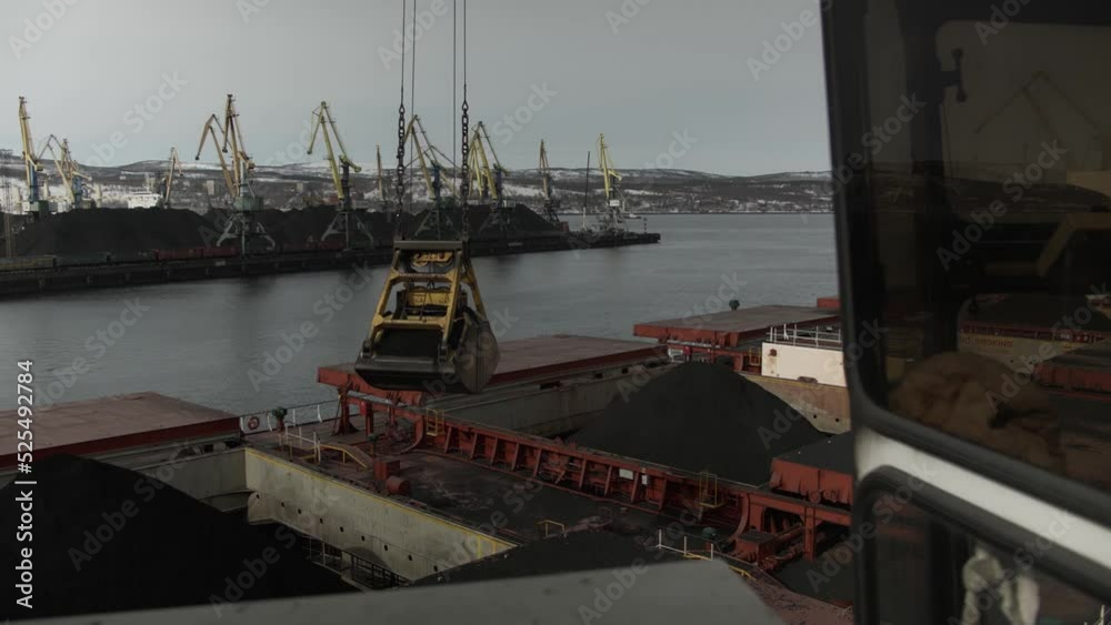 Port view from Crane operator cab. Control room with with levers ...