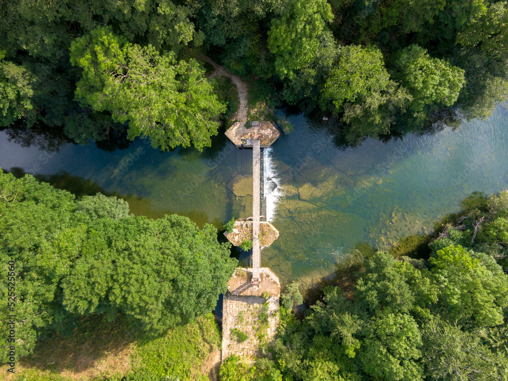 Overhead drone view of a wooden suspension bridge over the crystal ...