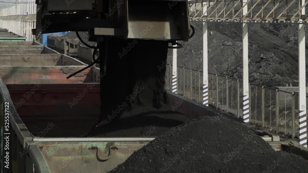Automatic loading of coal into railway wagons. During loading, train ...