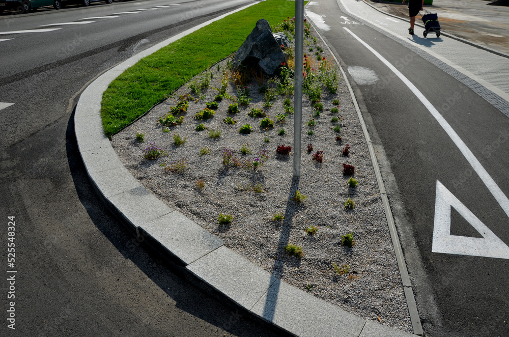 promenade for pedestrians and cyclists with a dividing island between ...