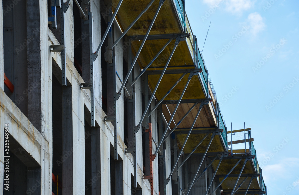 new concrete construction of an apartment building with windows to the ...