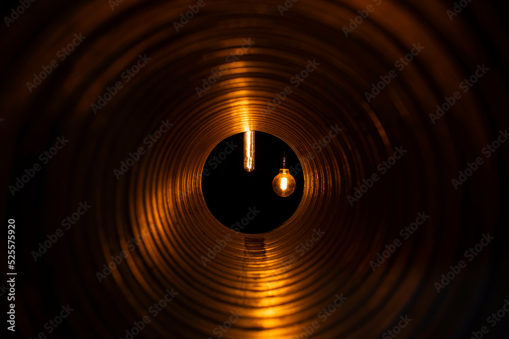 glowing bulbs with edison filament visible from the ventilation duct ...