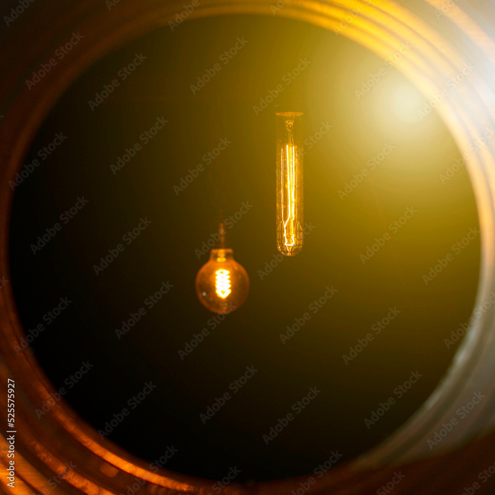 glowing bulbs with edison filament visible from the ventilation duct ...