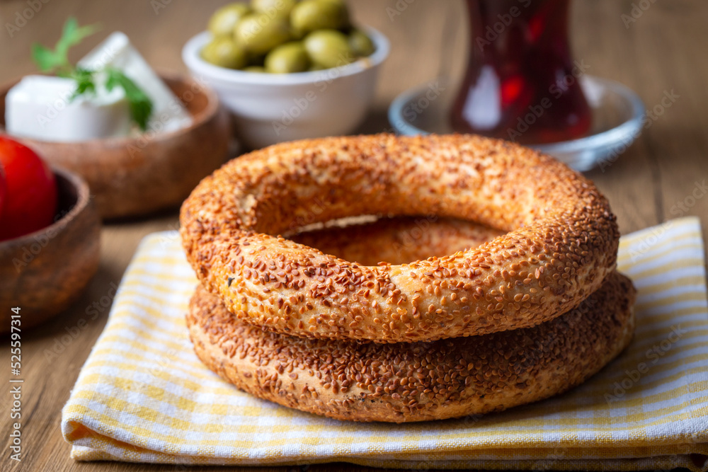 Turkish fast food bagel called Simit. Turkish bagel Simit with sesame. Bagel is traditional ...