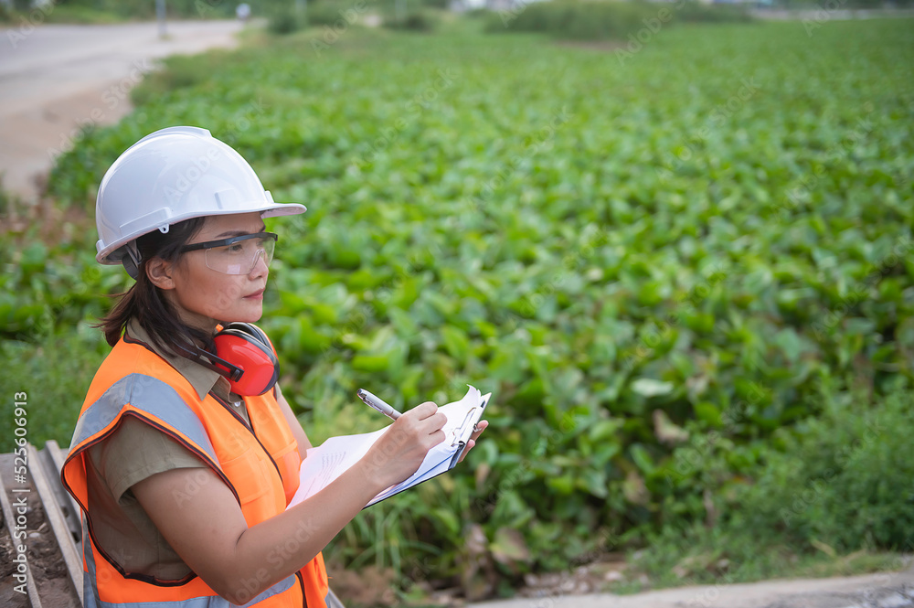 Environmental engineers work at the water storage plant, check the pH ...