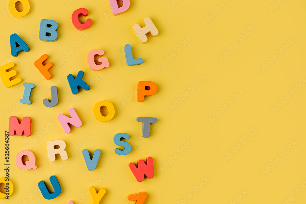 Colorful letters of the alphabet on yellow background. Primary school ...