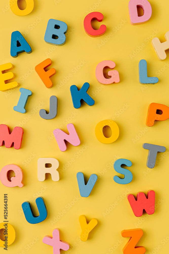 Colorful letters of the alphabet on yellow background. Primary school ...