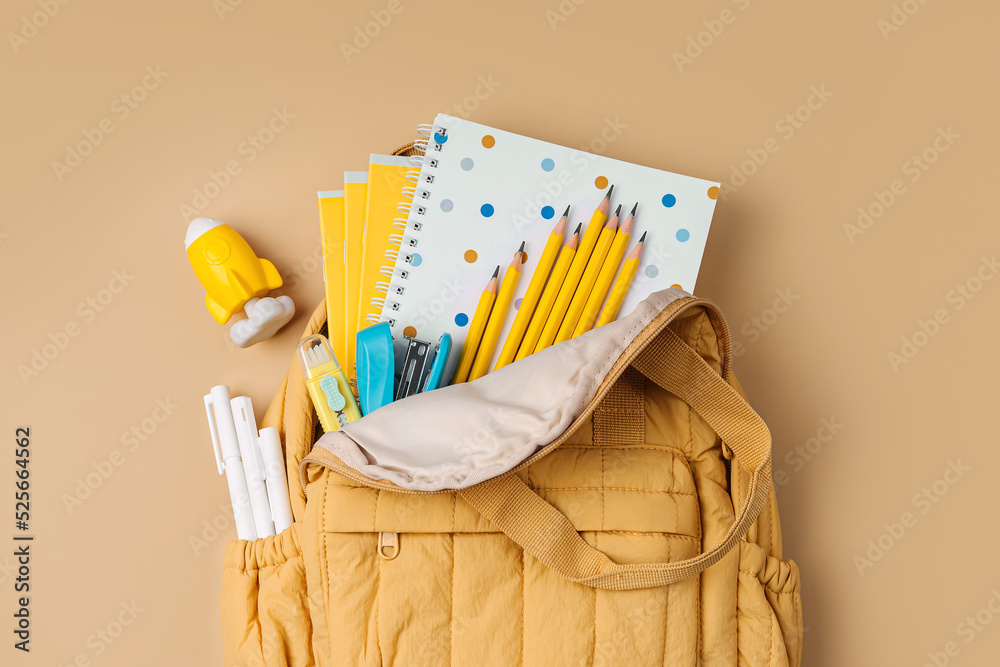 Opened School backpack with stationery. Primary school or preschool ...