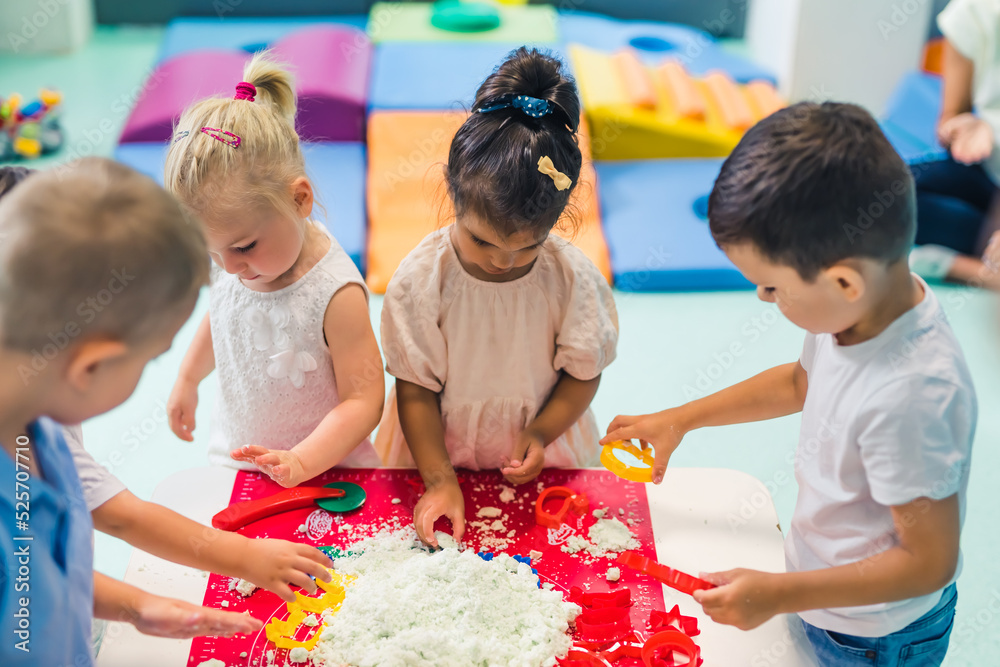 Fun sensory play with moldable and fluffy kinetic sand at nursery ...