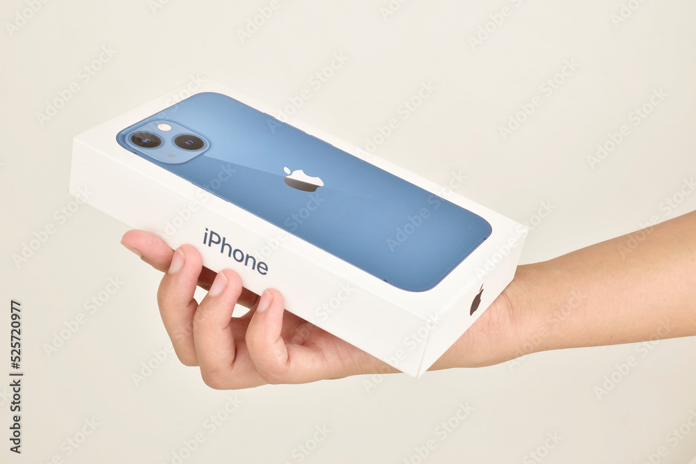 Hand holding iphone box isolated on white background Stock Photo ...