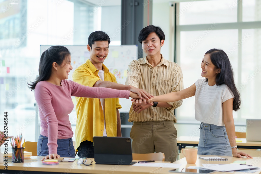 Young Asian business people working as a team meeting and work together ...