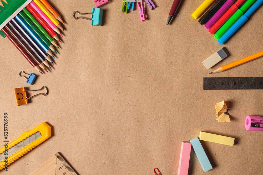 School office stationery on a brown paper background with space for ...