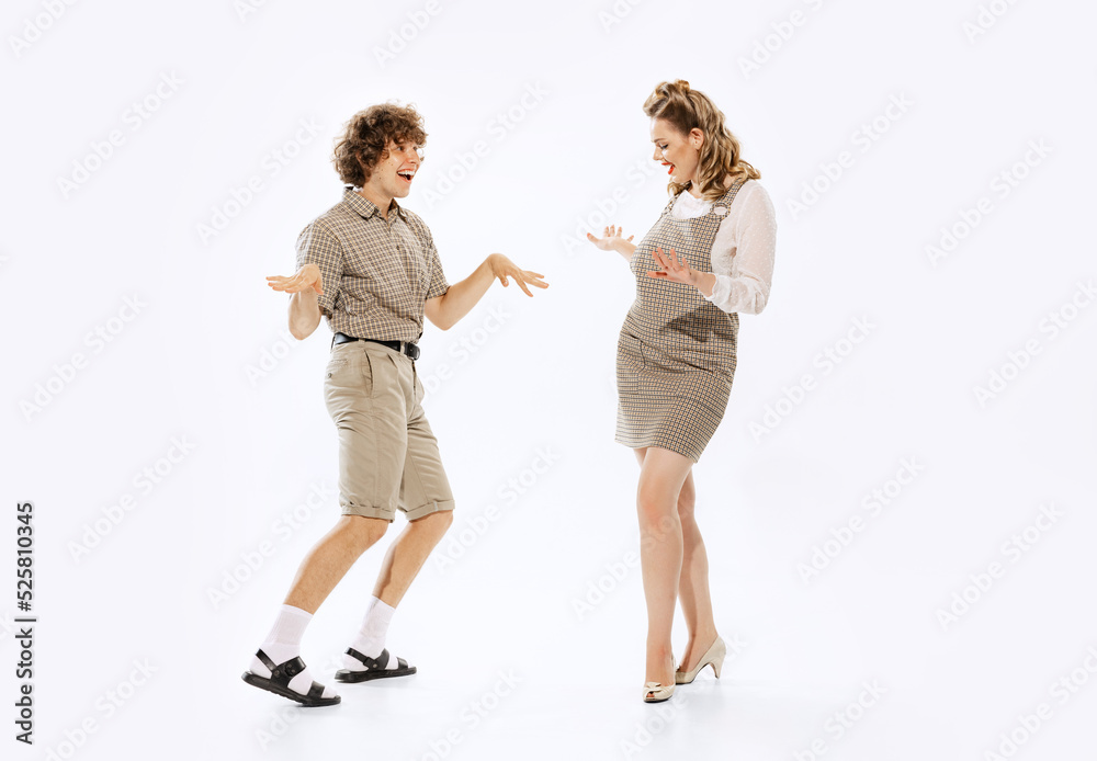 Expressive couple of dancers in vintage retro style outfits dancing ...