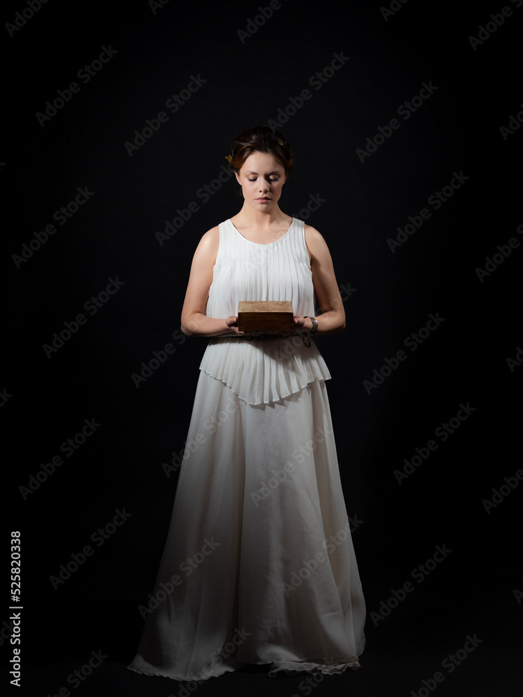 An ancient heroine holds a pandora's box in her hands, a young woman in ...